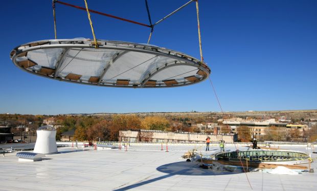 Crews install elliptical dome at new library