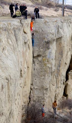 Firefighters rescue boy trapped along Rimrocks