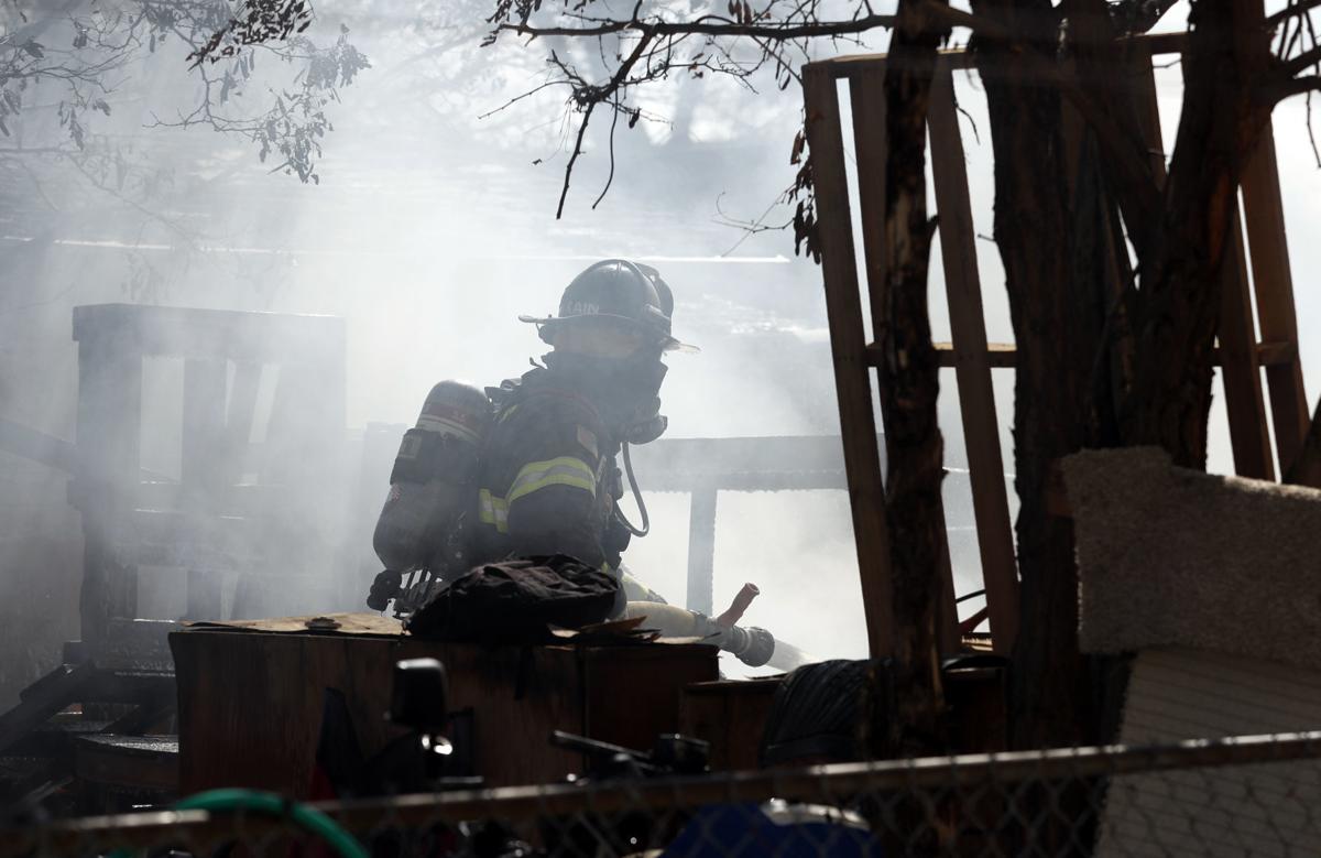 Photos: Fire burns items, shed in South Side backyard