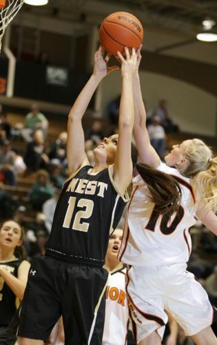 Jessica Lampi of West and Marissa Van Atta of Senior battle