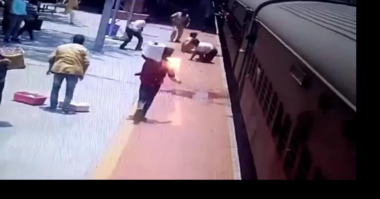 Shocking moment boy falls onto tracks while trying to catch moving ...