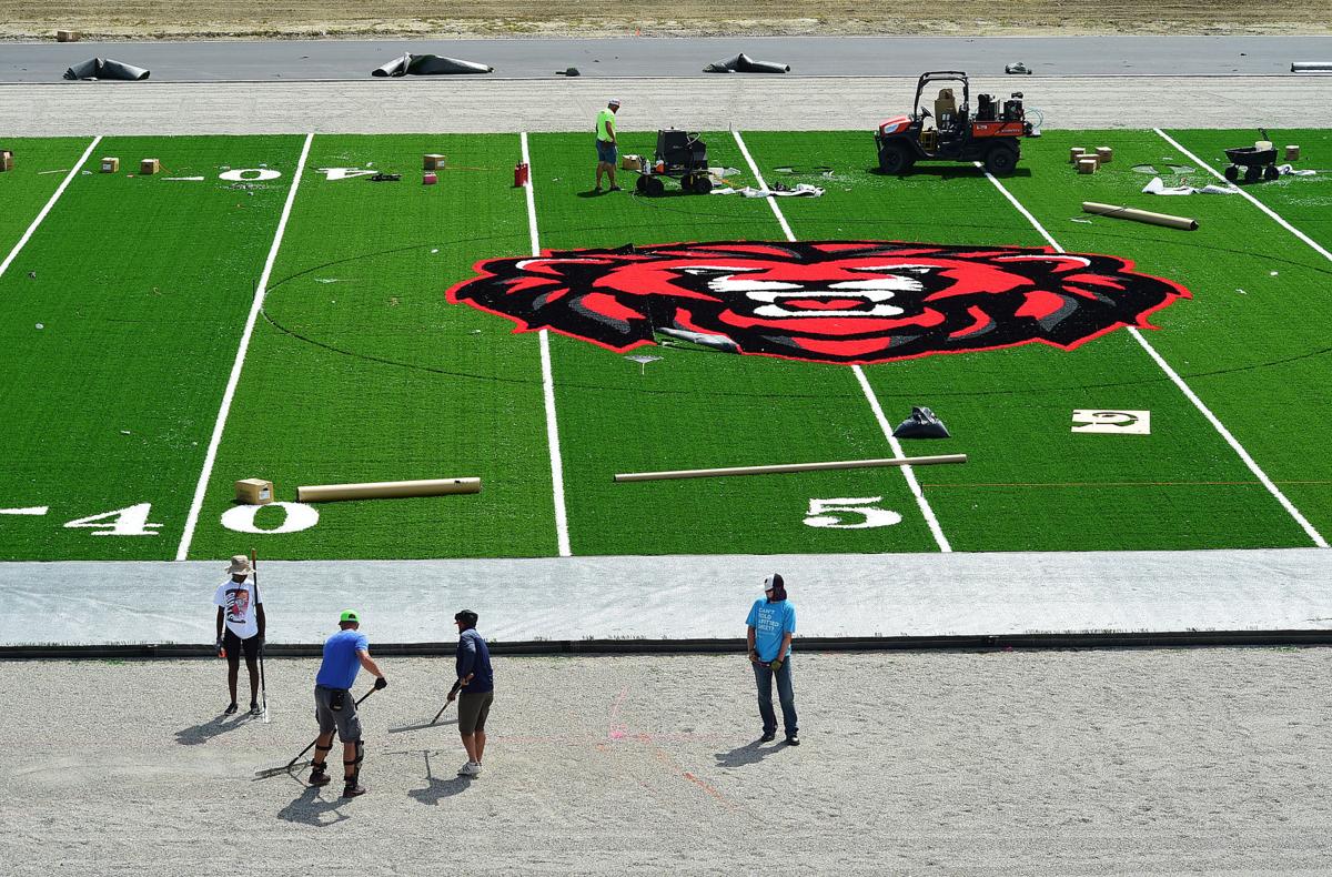 Photos: Crews finishing up turf on Lockwood Lions football field