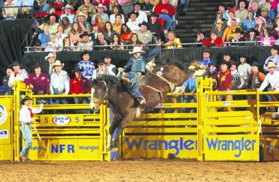 Etbauer brothers riding into rodeo hall together
