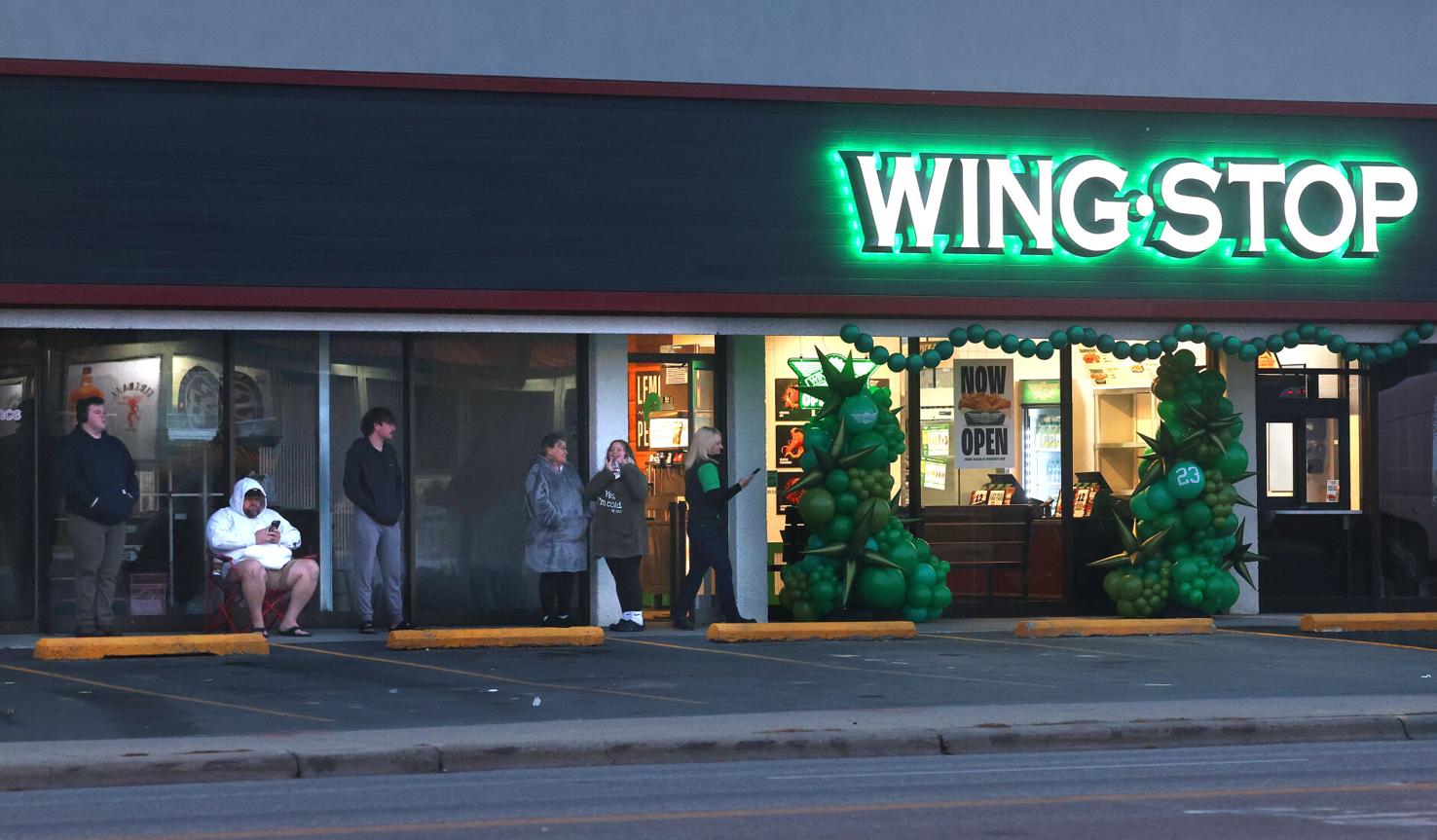 Customers wait for 8 a.m. Wingstop opening in Billings
