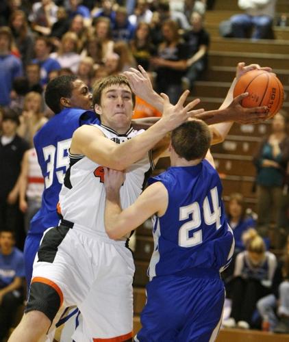 Senior's Tyler Webb gets tied up with Cameron Evans