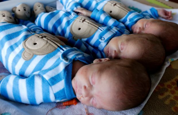 One-in-a-million family: Couple welcomes rare spontaneous identical ...