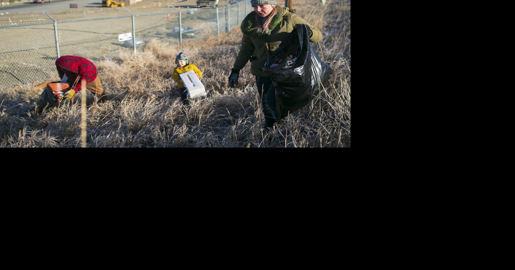 Photos: Concerned residents tackle wind-blown trash