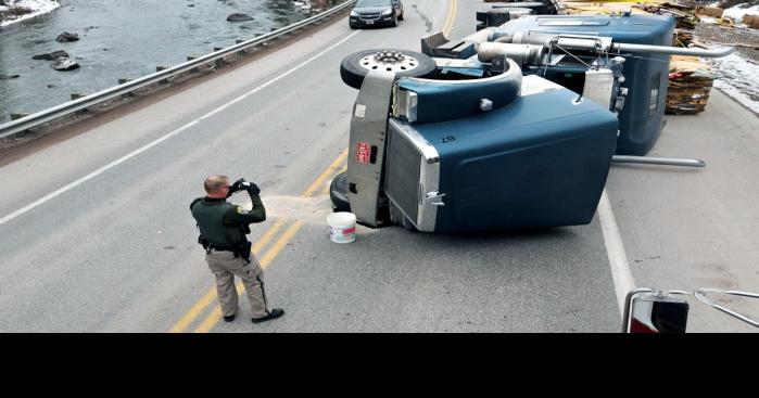 Montana Highway Patrol trooper Rob Strauch photographs wreckage