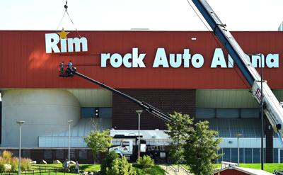 Photo: Crews change the name on MetraPark's arena