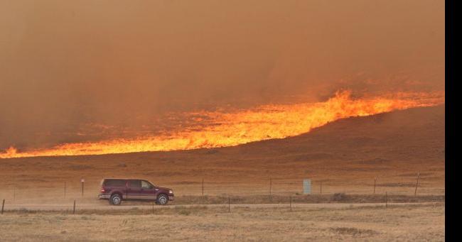 A pickup makes it out just ahead of the Rosebud fire