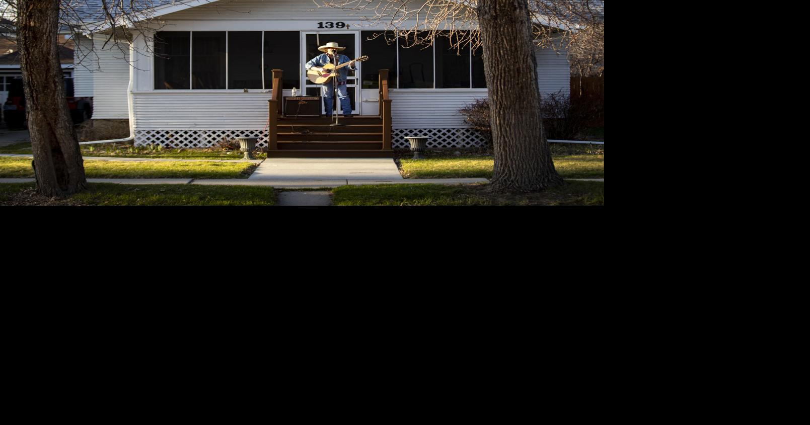 Photos: Ron Garritson plays for his neighbors from his porch