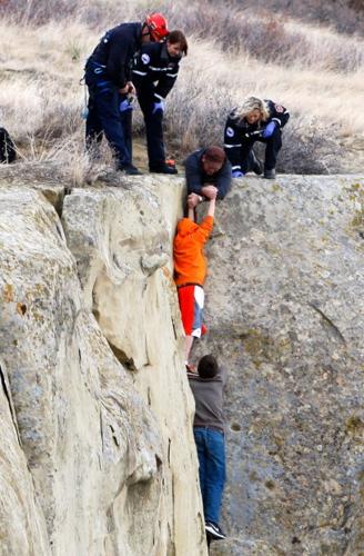 Firefighters rescue boy trapped along Rimrocks