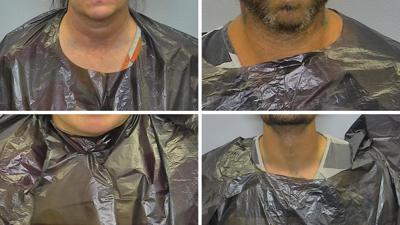 Detention center using smocks to hide stripes in mug shots