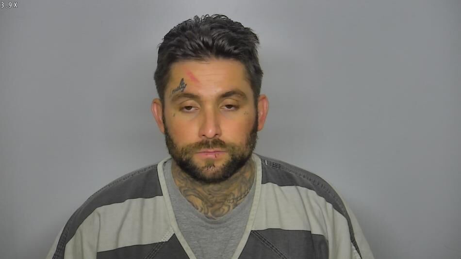 Bismarck man accused of attacking mother, standoff