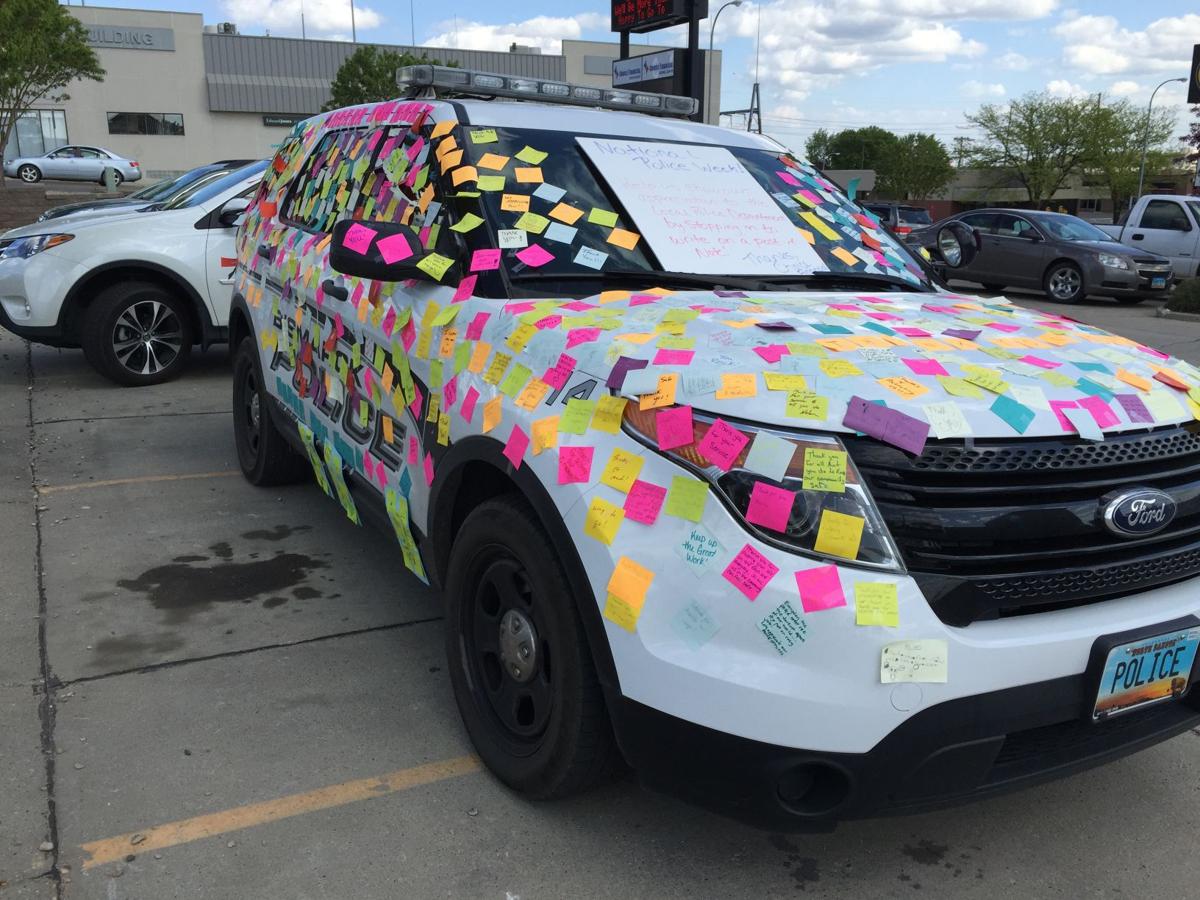 Community decorates squad car with thank-you notes