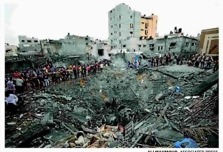 Families in Gaza dig through rubble for bodies