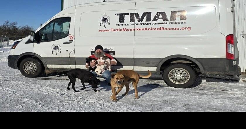 Keith Benning poses with some animals