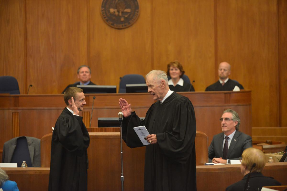 Justice Jon Jensen installed in ceremony