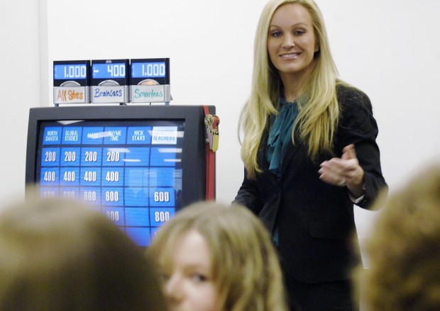 Middle school students play educational quiz game