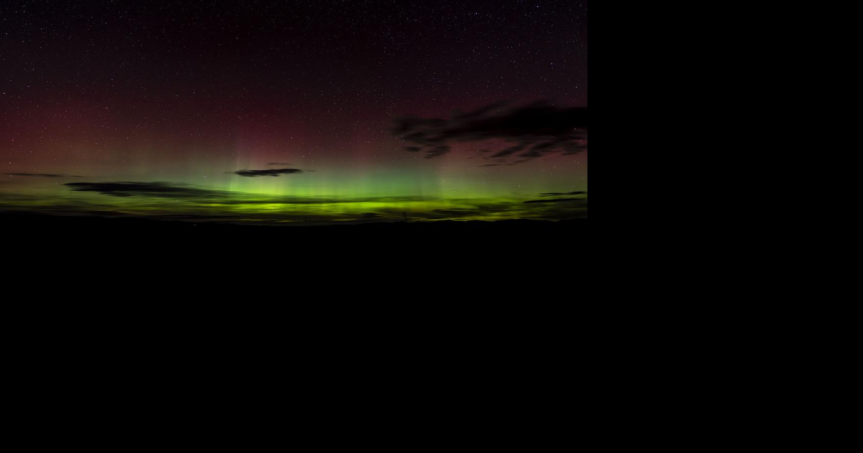 The northern lights dance across the night sky from Flathead Creek Road ...