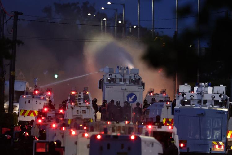 Police blast water cannons at Belfast protesters as unrest flares again ...