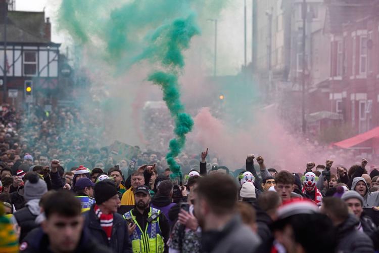 Man United fans wear clown masks in latest protest at club's owners ...
