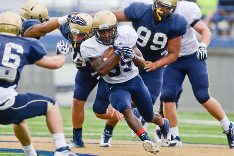 Defense stout up front, offense goes deep in opening scrimmage ...