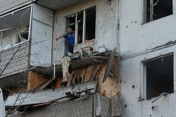 Russian attack on Ukraine capital kills at least 3 and traps others in ...