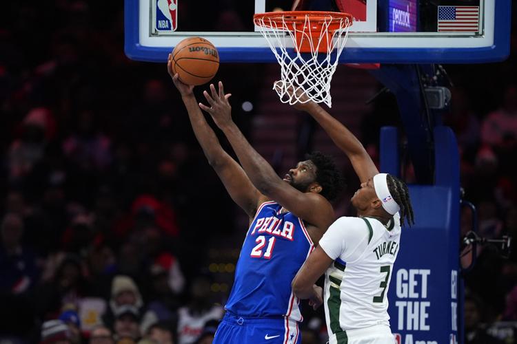 George scores 32 and Embiid has 29 to lead 76ers past short-handed ...