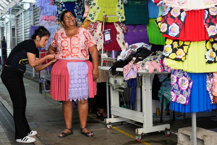 Photos of Bolivian cholitas embracing the bell skirt as a symbol of ...