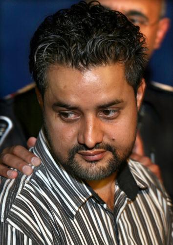 Dead wife's husband worked as police agent