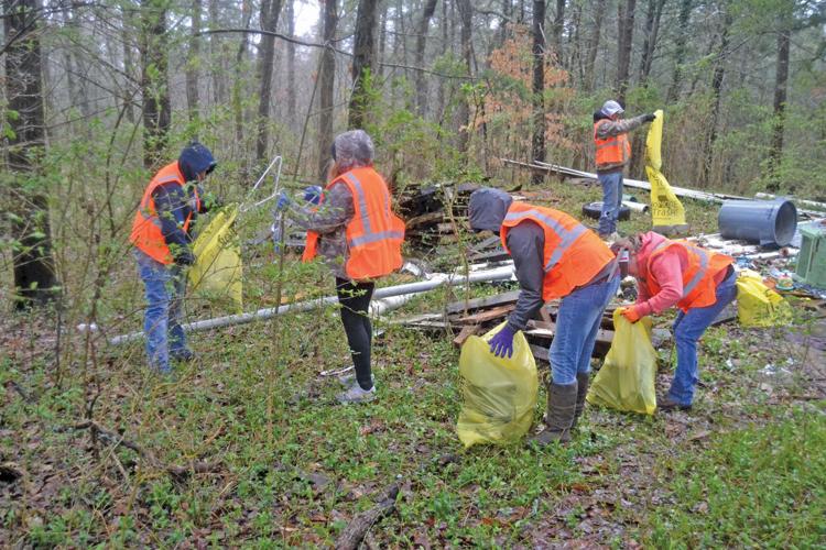 Community rallies to clean abandoned homeless camp | News Free ...