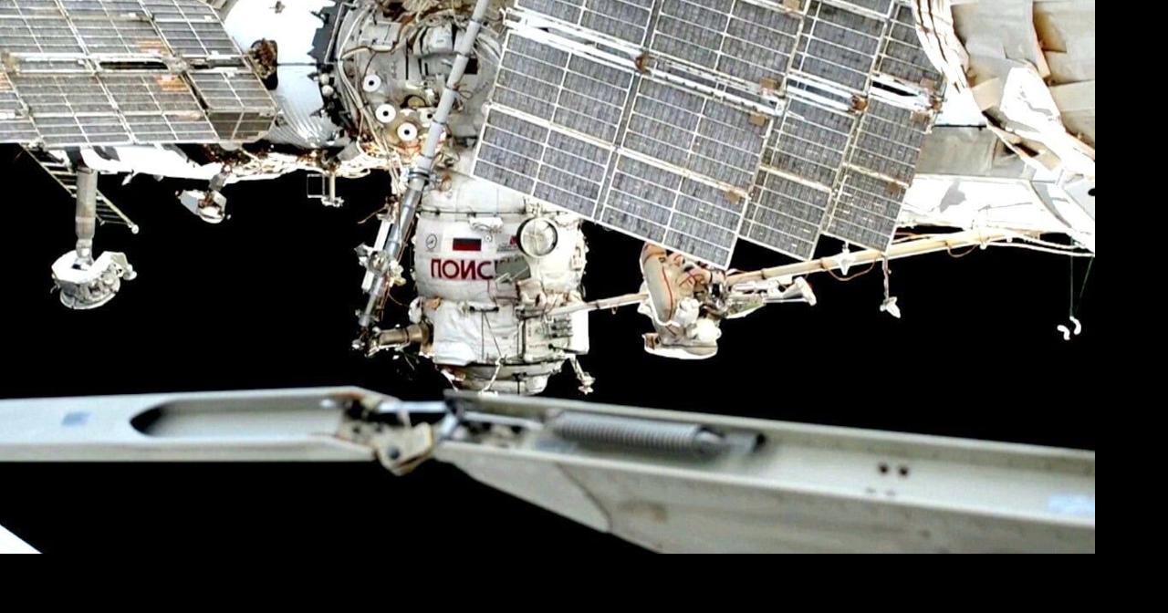 Russian cosmonauts take a spacewalk to relocate a radiator unit on ISS