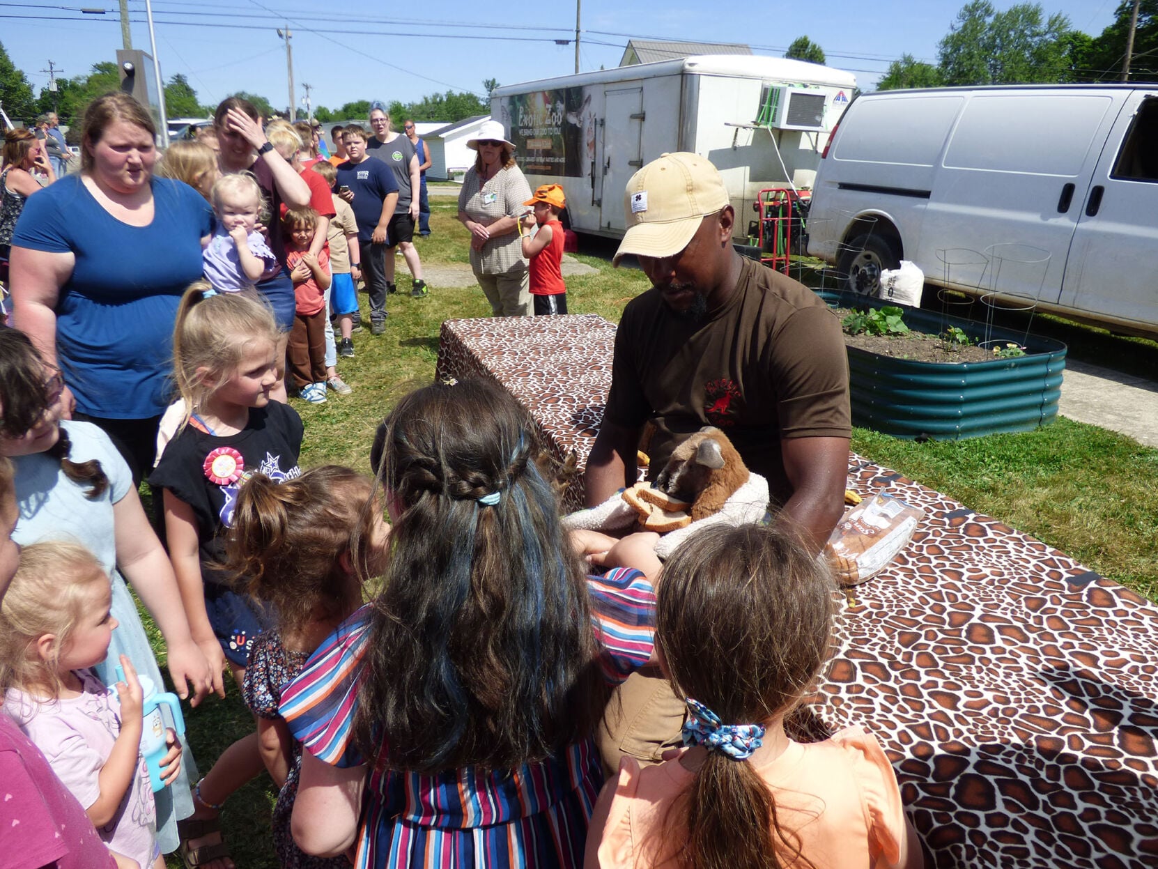 Kids pet a baby kangaroo | Obituaries | bryantimes.com
