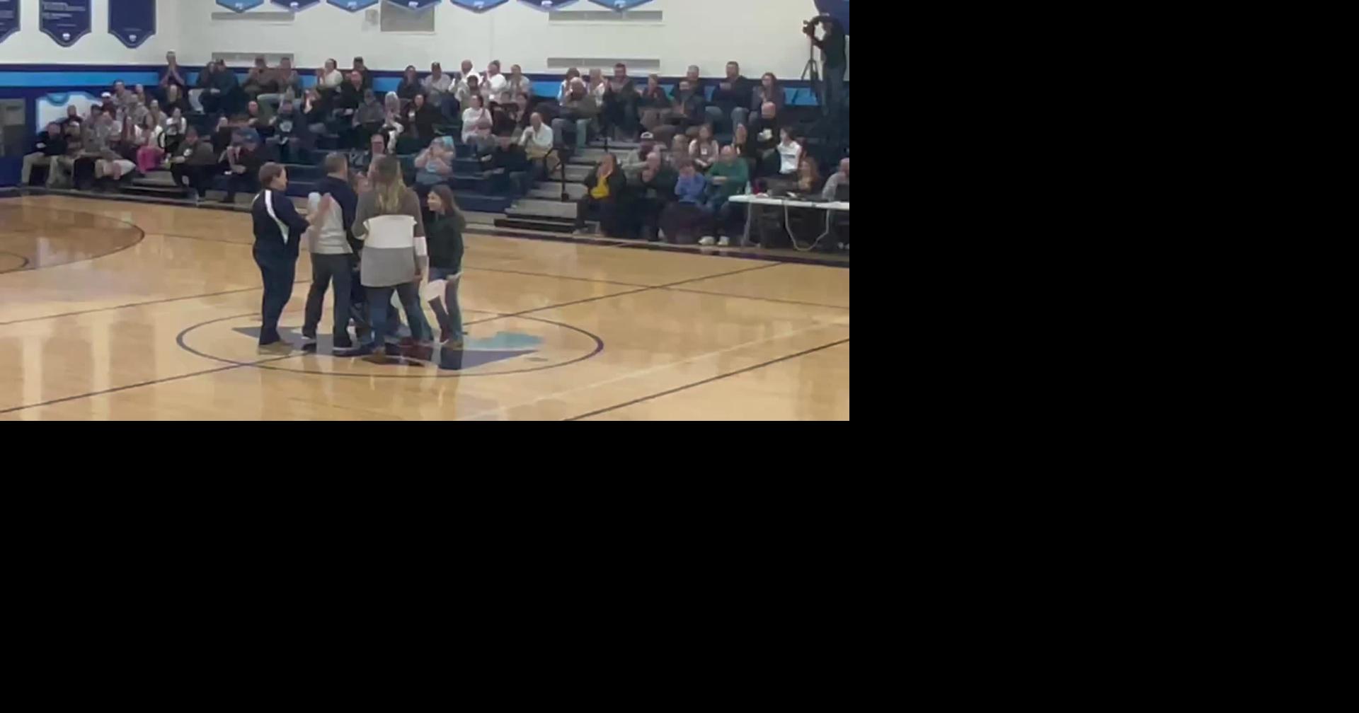 Depew boys basketball coach Larry Jones is greeted by his family on ...