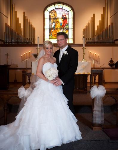 Laura M. Rovner and Aric J. Fecher wed in Zion Lutheran Church