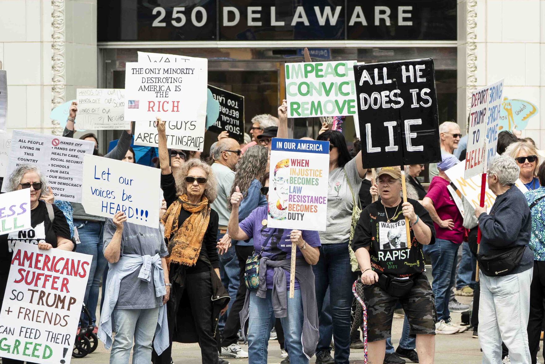 Photos: Local organizations rally for May Day protest outside Delaware ...
