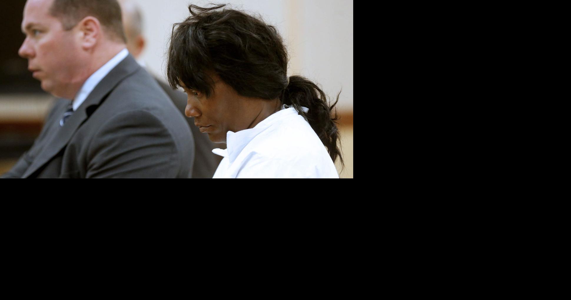 Woman arraigned in slaying