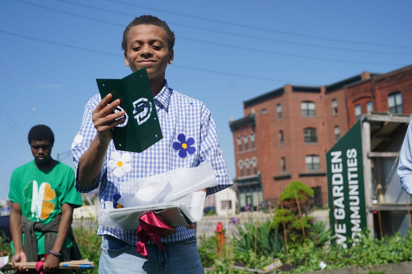 Falk students give handmade tools to community gardens group