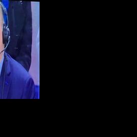 Sabres broadcaster Rob Ray takes puck to face during game