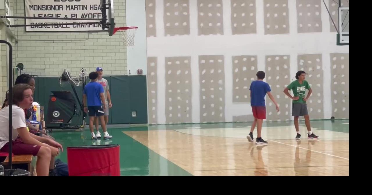 Shane Cercone gets a few moments of 1-on-1 basketball instruction from ...