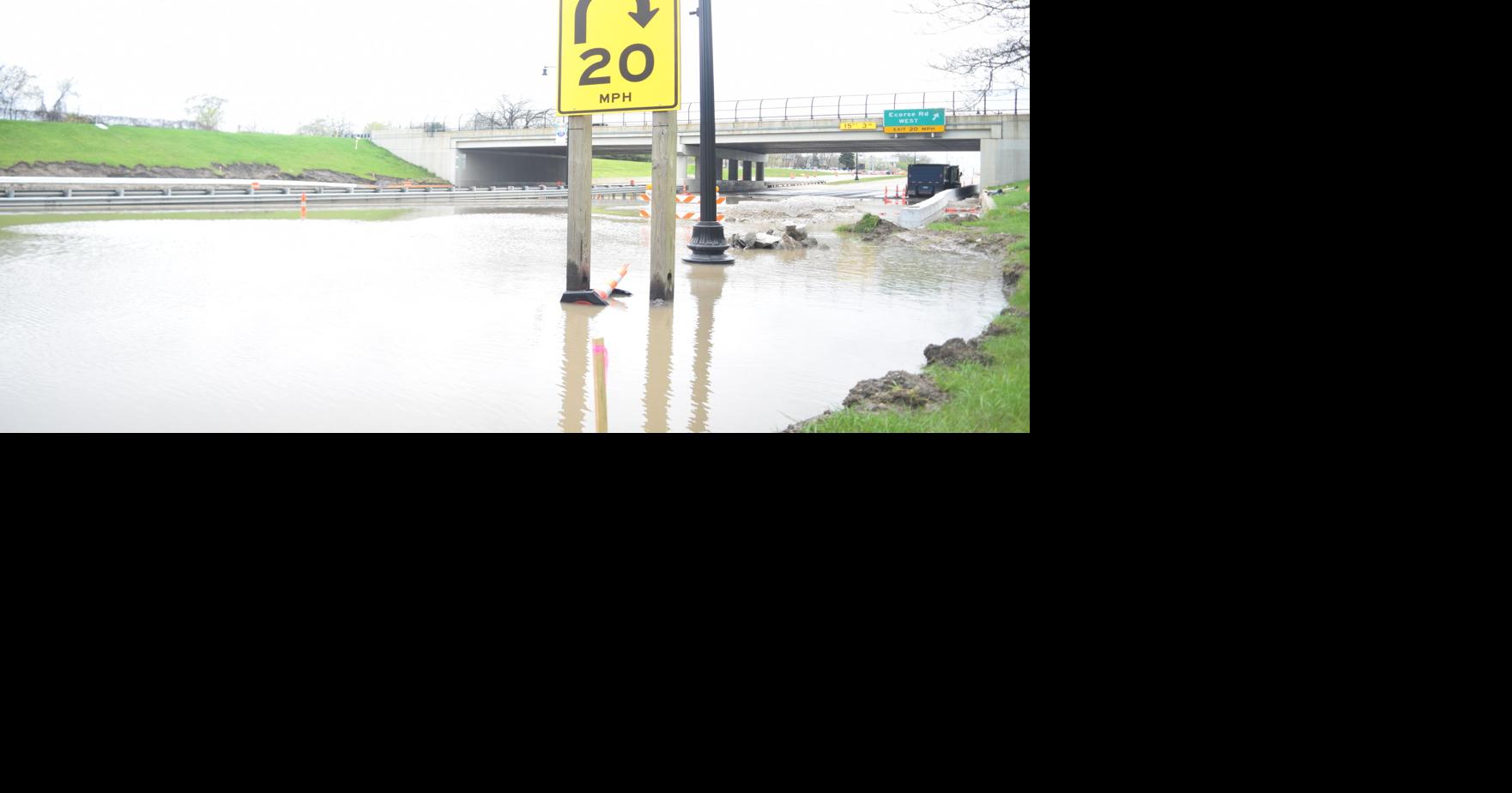 Flooding closes Downriver roads, schools; residents deal with basement ...