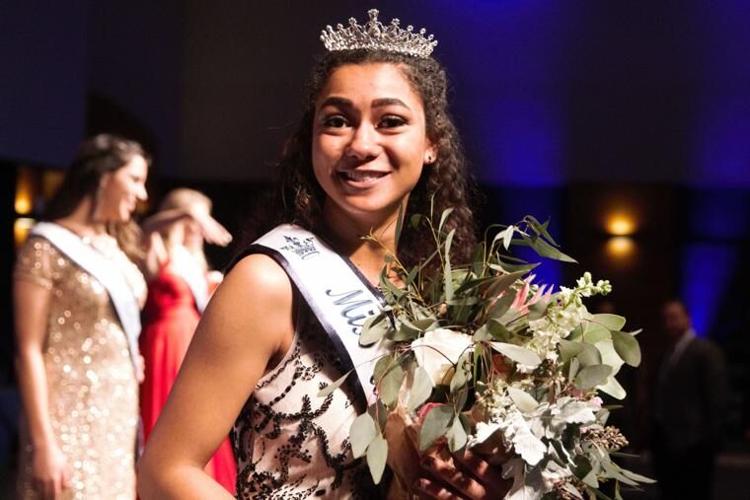 A poem entitled ‘Who Am I’ gets a standing ovation and helps crown the ...