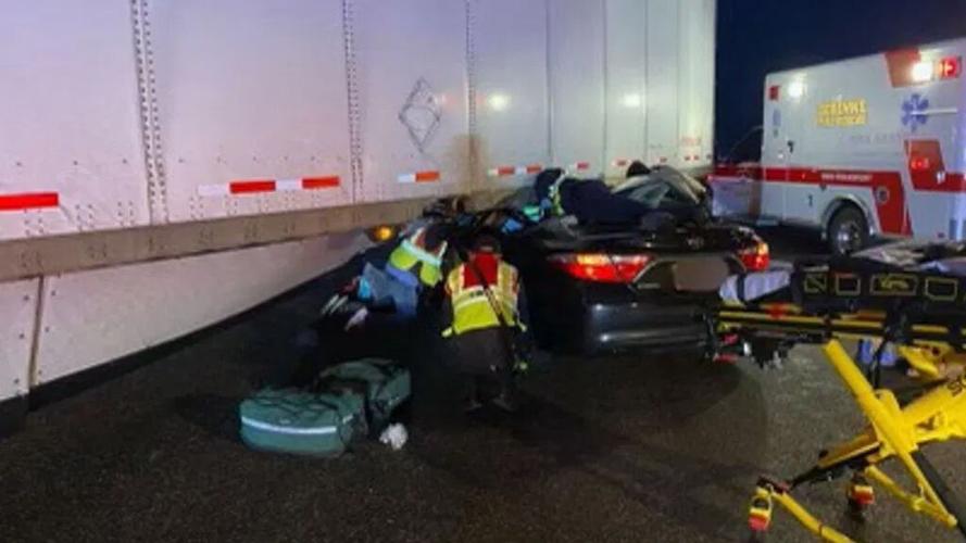 Driver hospitalized in serious condition after car becomes pinned under ...