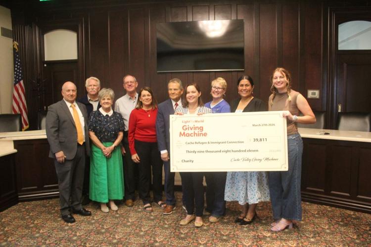 Light the World Giving Machine donates thousands of dollars to local ...