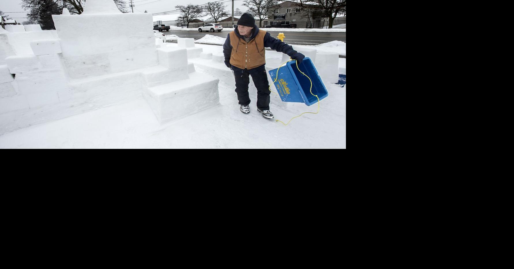 Cambridge man builds a snow castle to keep busy