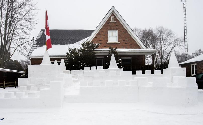 Cambridge man builds a snow castle to keep busy