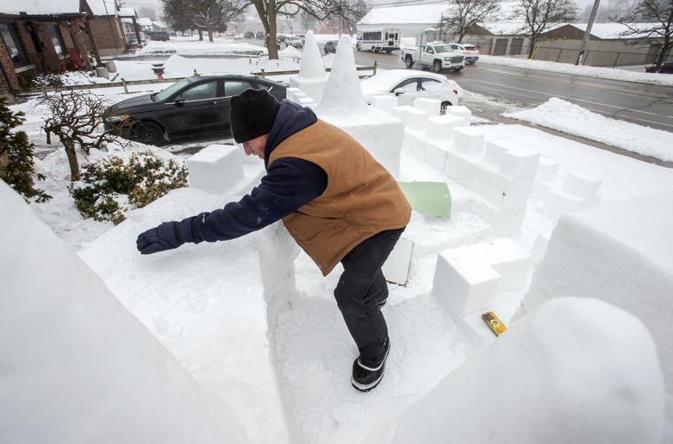 Cambridge man builds a snow castle to keep busy