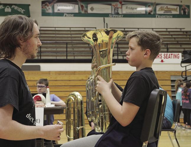 “Instrument petting zoo” gets young students buzzing for band | News ...