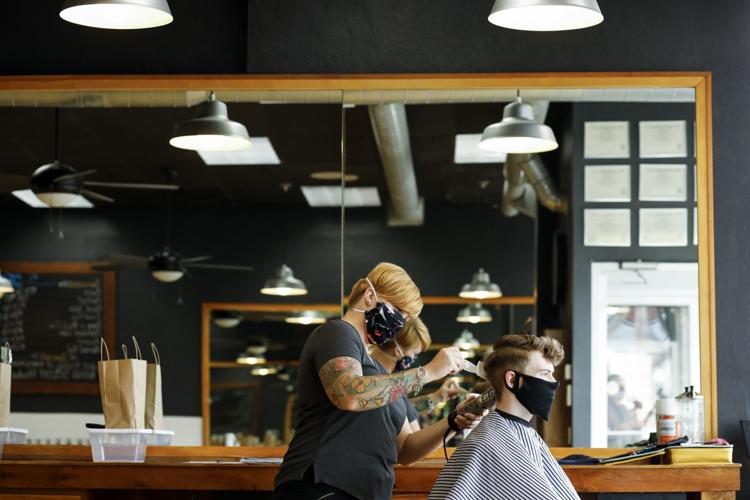 Shuttered for months by coronavirus, hair salons and barbershops reopen ...